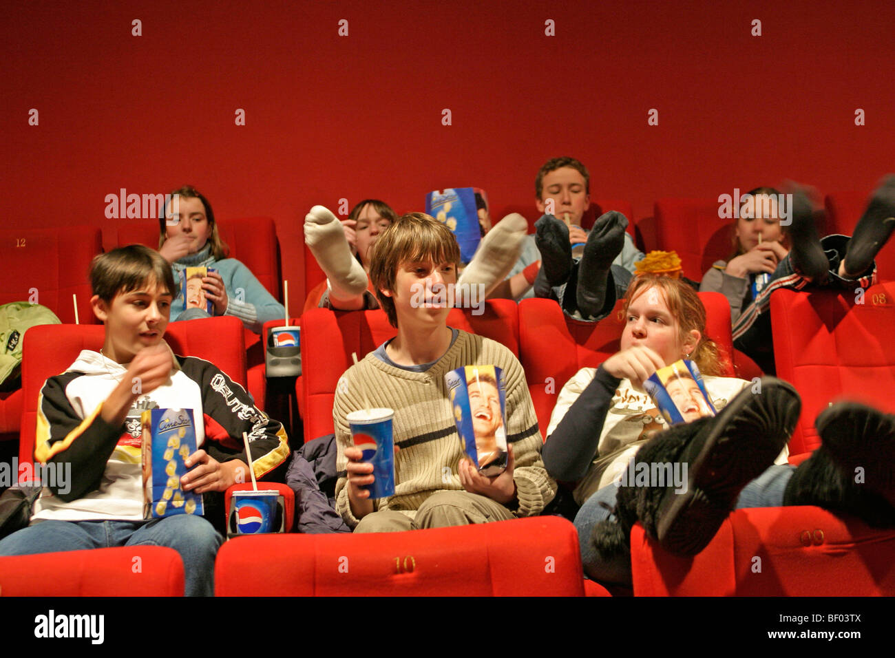 a group of teenagers in a cinema Stock Photo - Alamy