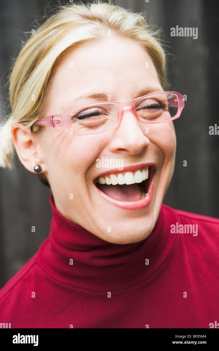 Close-up of a woman laughing Stock Photo - Alamy