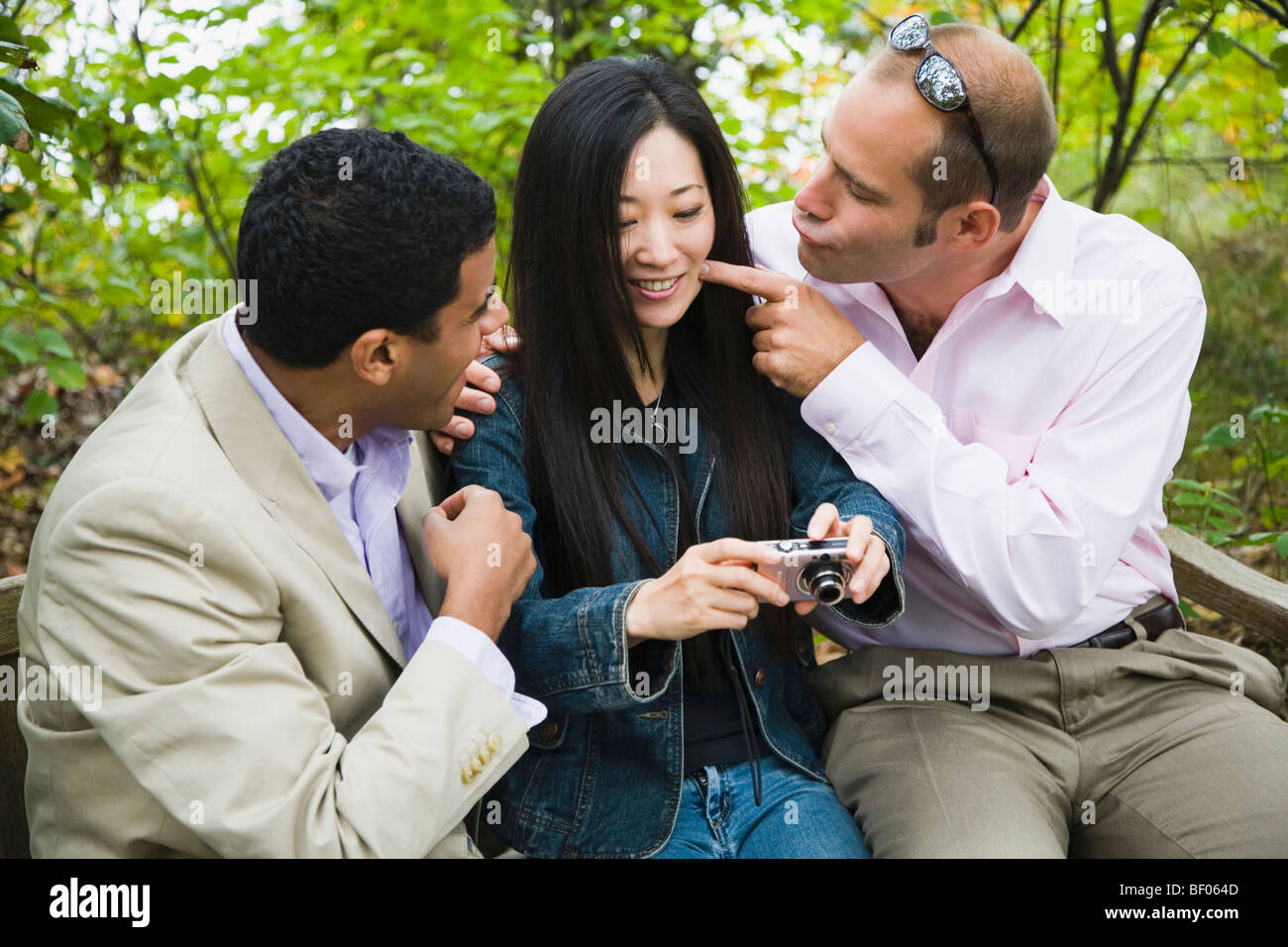 Men flirting with a woman Stock Photo - Alamy