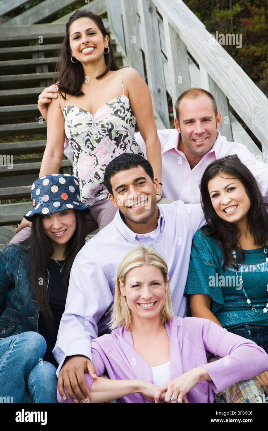 Group of friends smiling Stock Photo - Alamy