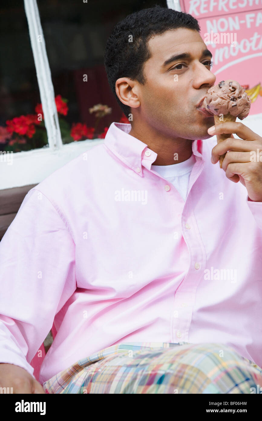 Man eating an ice-cream Stock Photo - Alamy