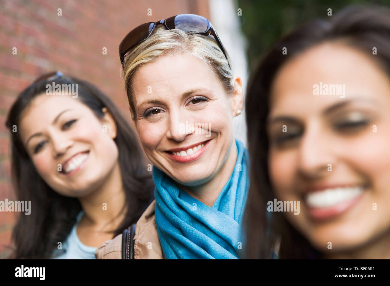 Portrait of three women smiling Stock Photo - Alamy