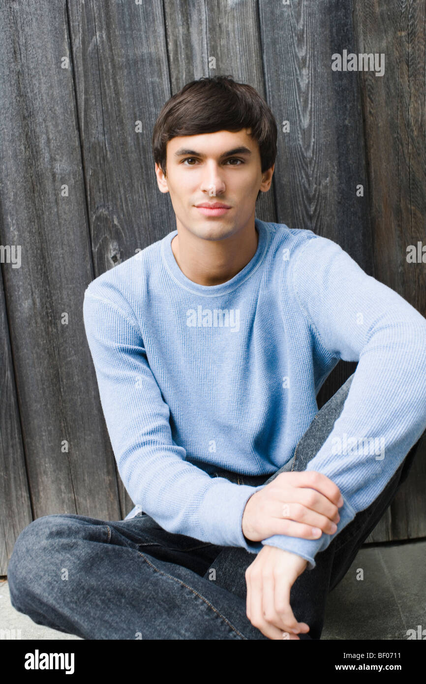 Portrait of a man sitting Stock Photo - Alamy