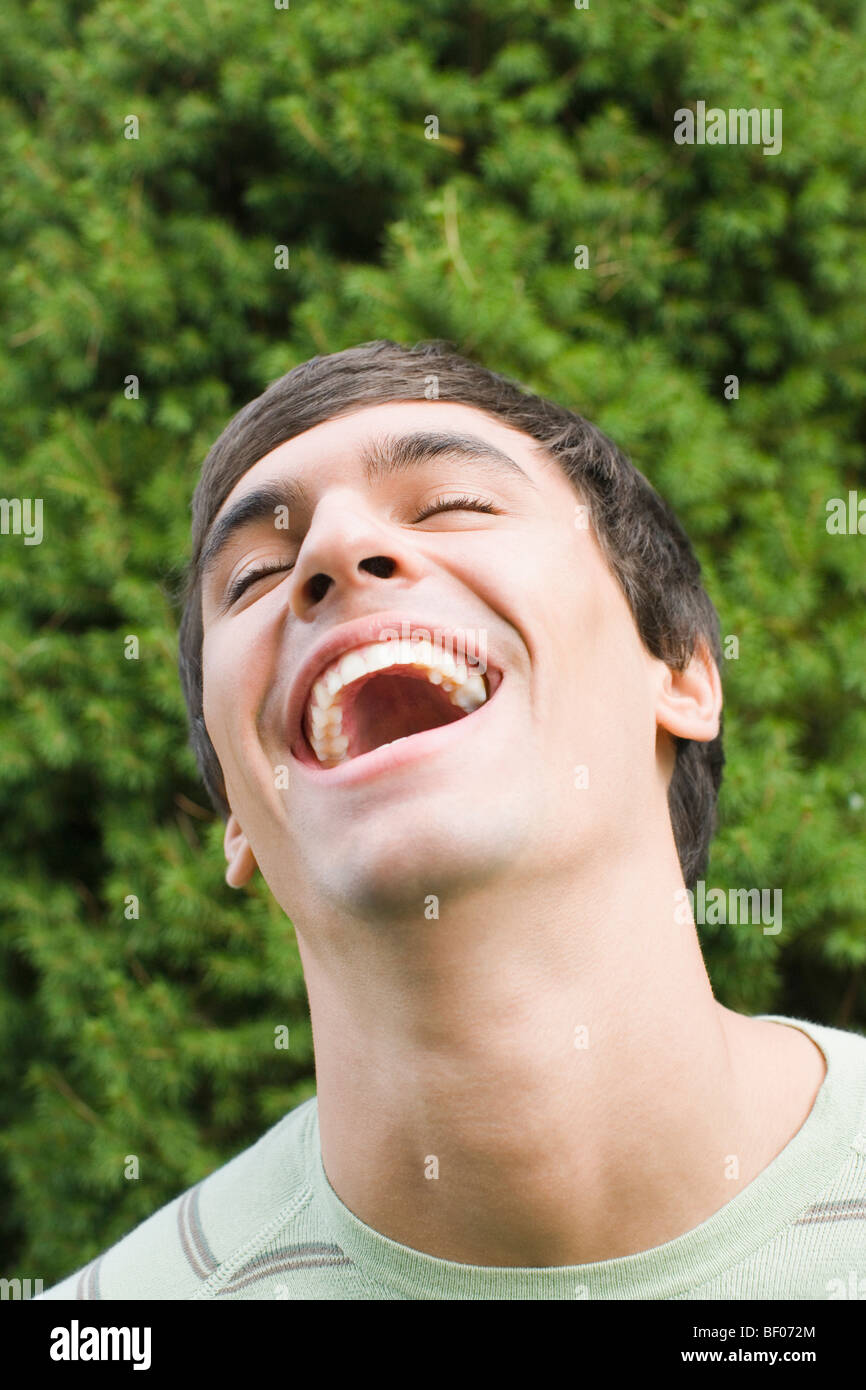 Close-up of a man laughing Stock Photo - Alamy
