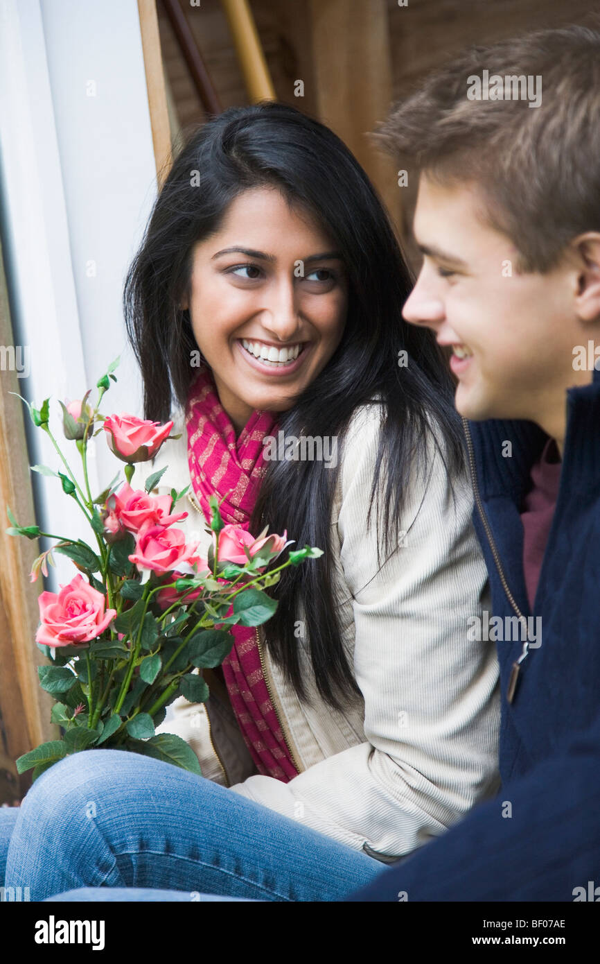 Couple smiling at each other Stock Photo - Alamy