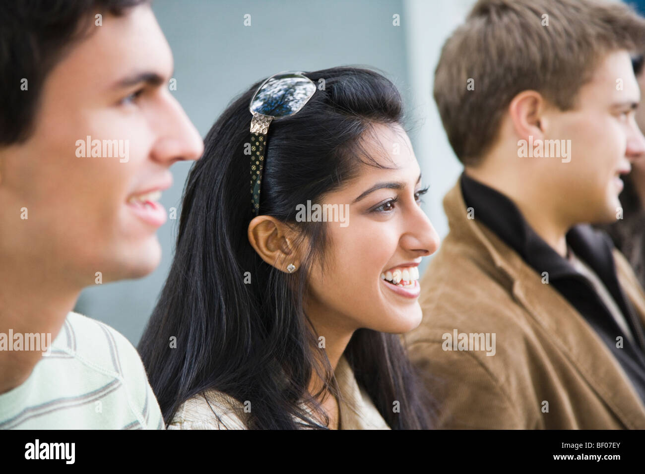 Close-up of happy woman smiling with her friends Stock Photo - Alamy