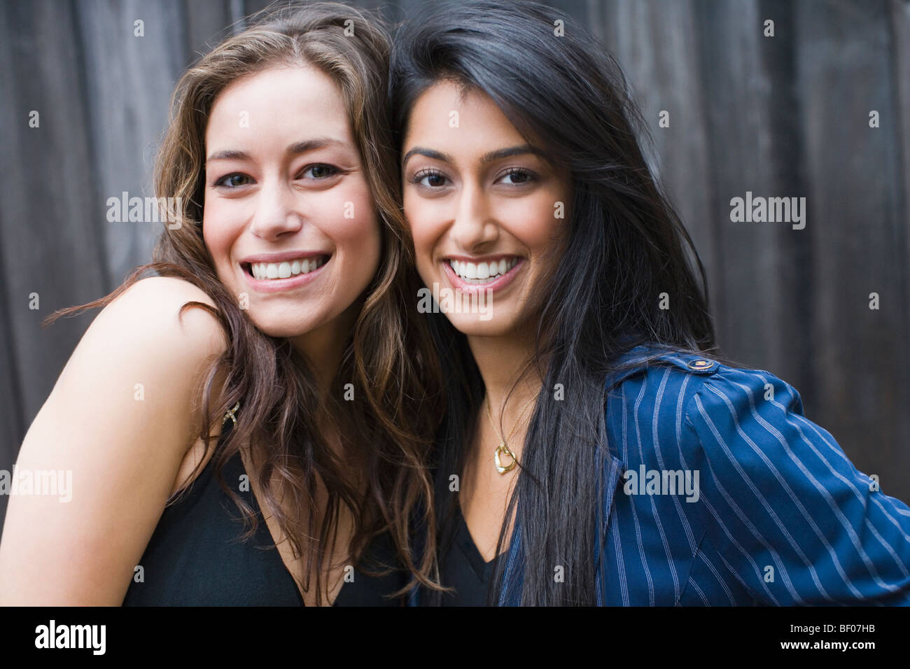 Portrait of two women smiling Stock Photo - Alamy