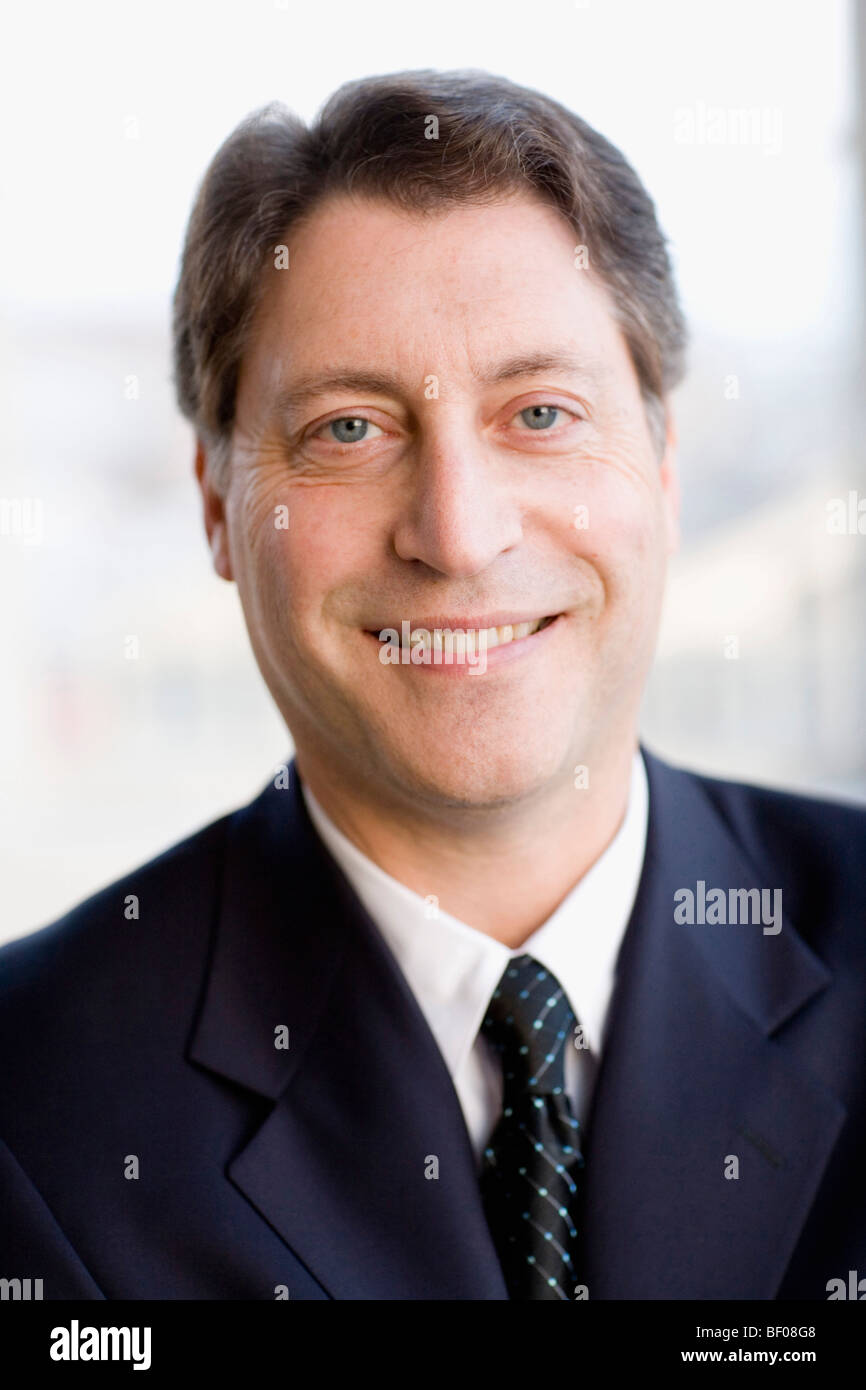 Portrait of a businessman smiling Stock Photo - Alamy