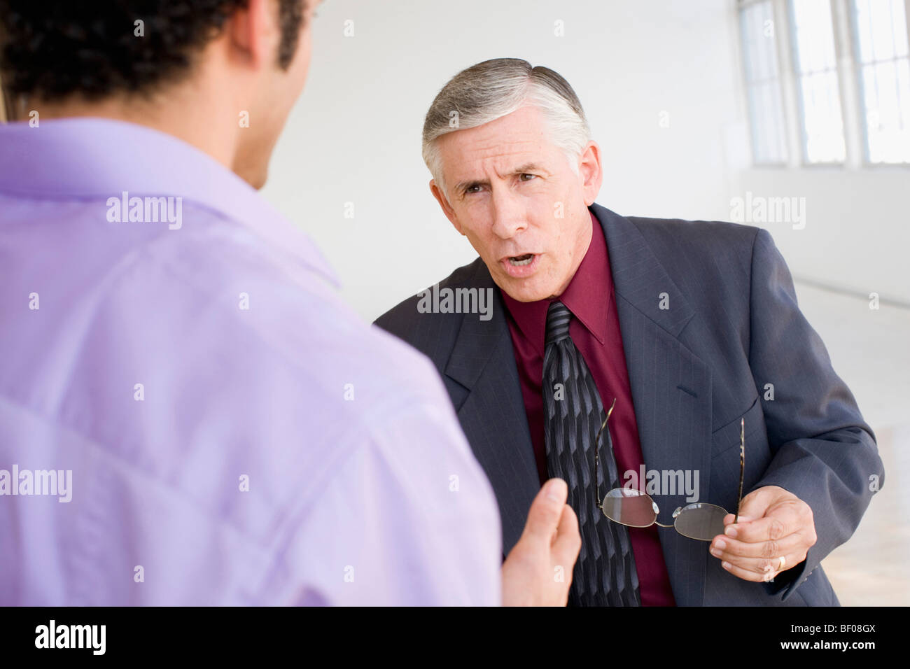 Two businessmen arguing with each other Stock Photo - Alamy