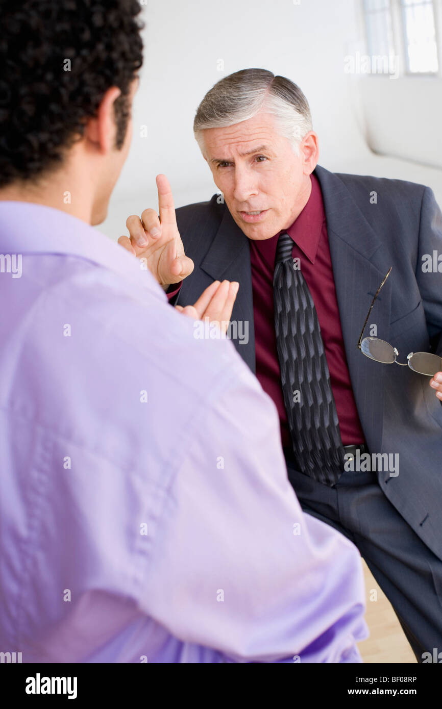 Rear view upset man standing hi-res stock photography and images - Alamy