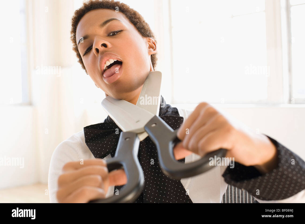 Woman scissors tongue cut hi-res stock photography and images - Alamy