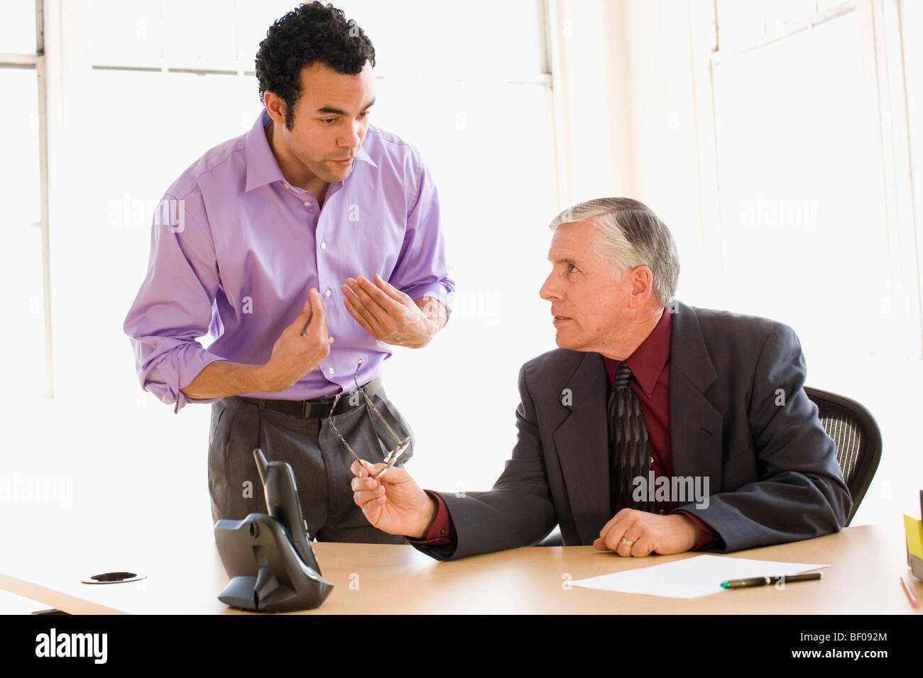 Upset mixed race businessman sitting hi-res stock photography and ...