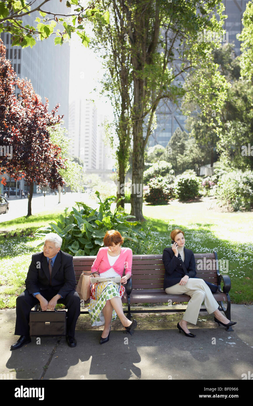 Two men people sitting down on a bench outdoors hi-res stock ...