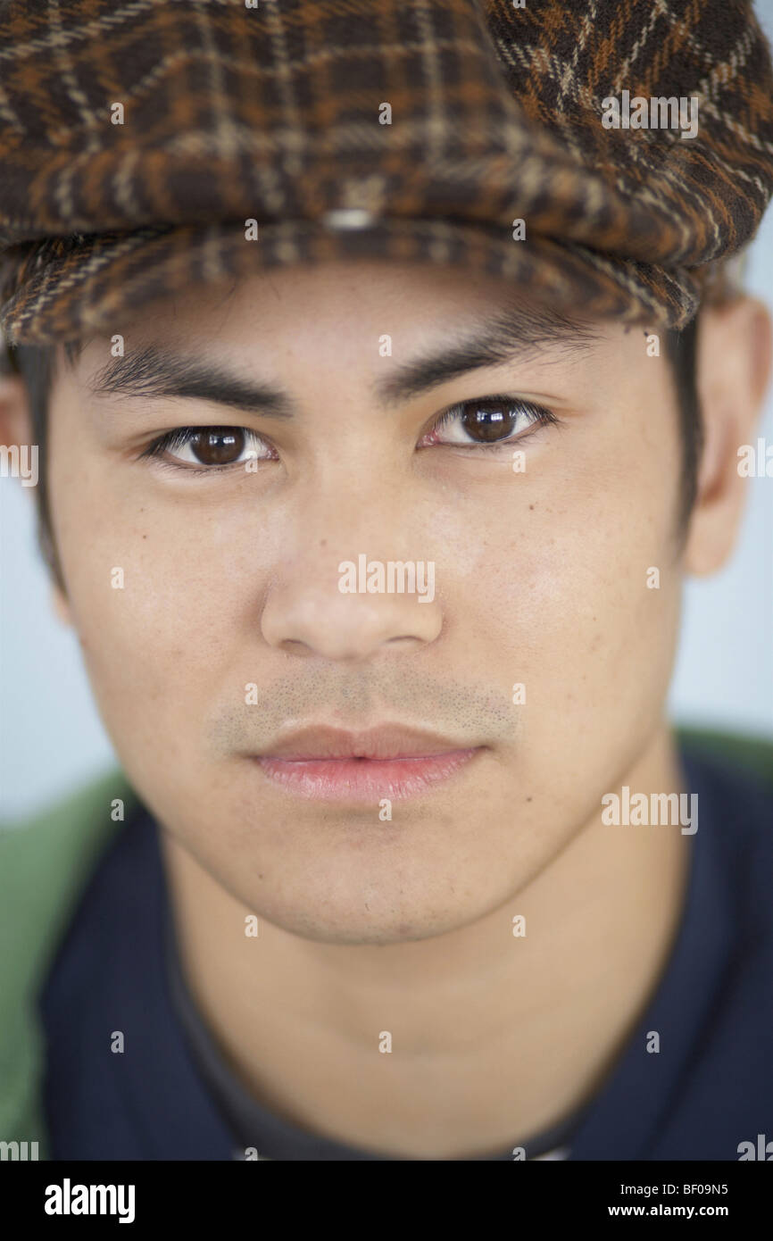Portrait of a teenage boy looking serious Stock Photo - Alamy
