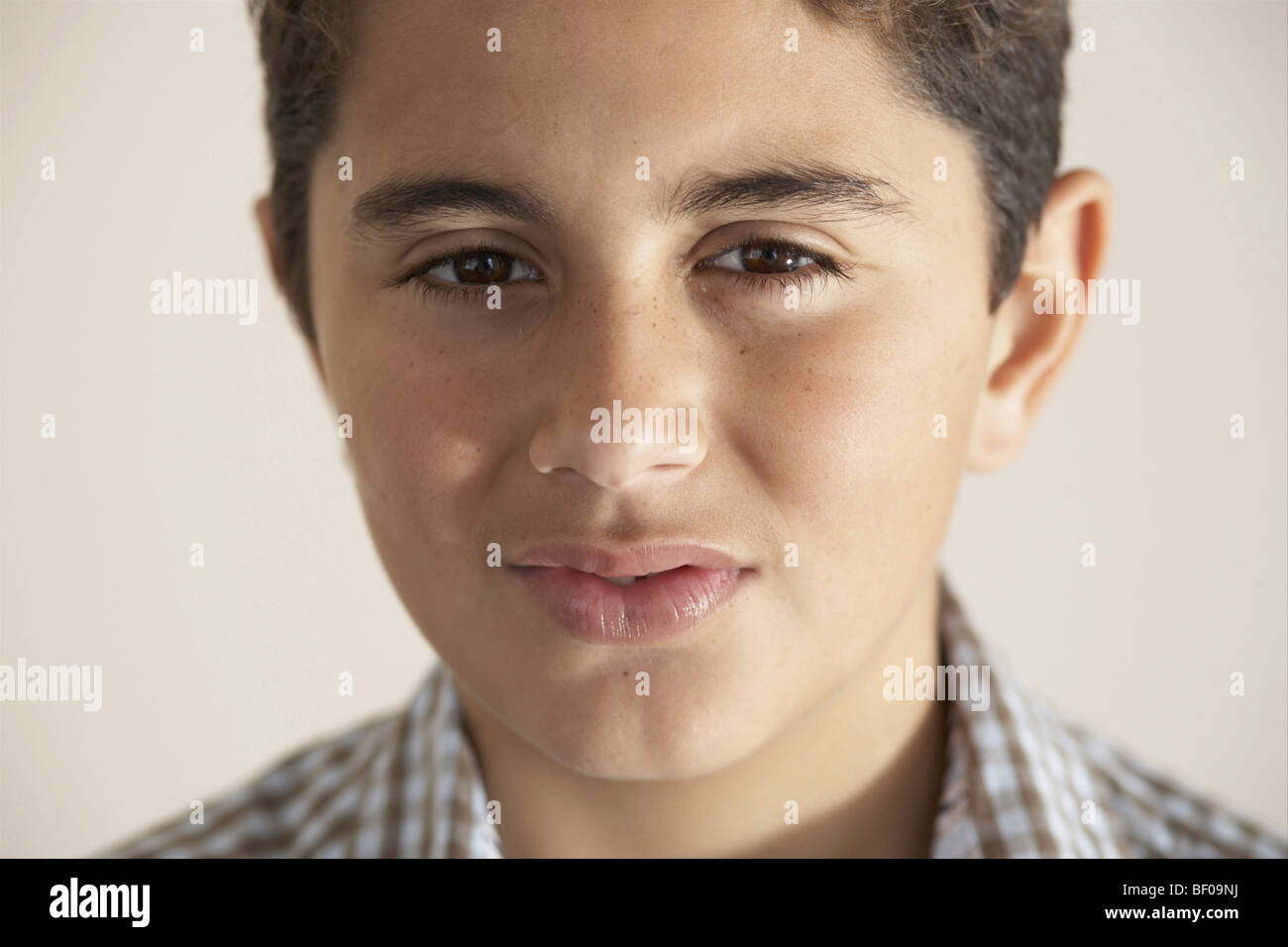 Portrait of a boy looking serious Stock Photo - Alamy