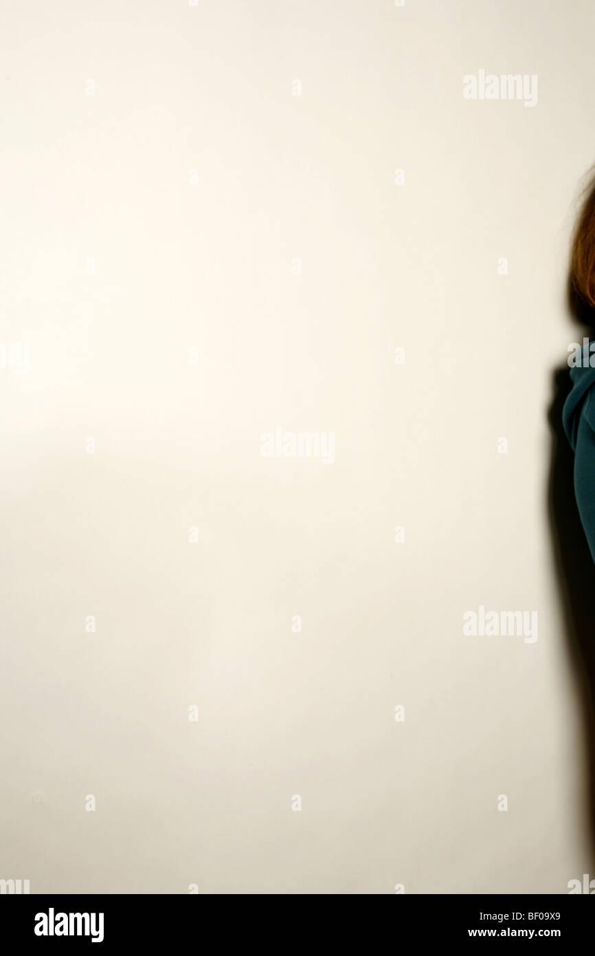 a tiny portion of teenage girl going out of frame Stock Photo - Alamy