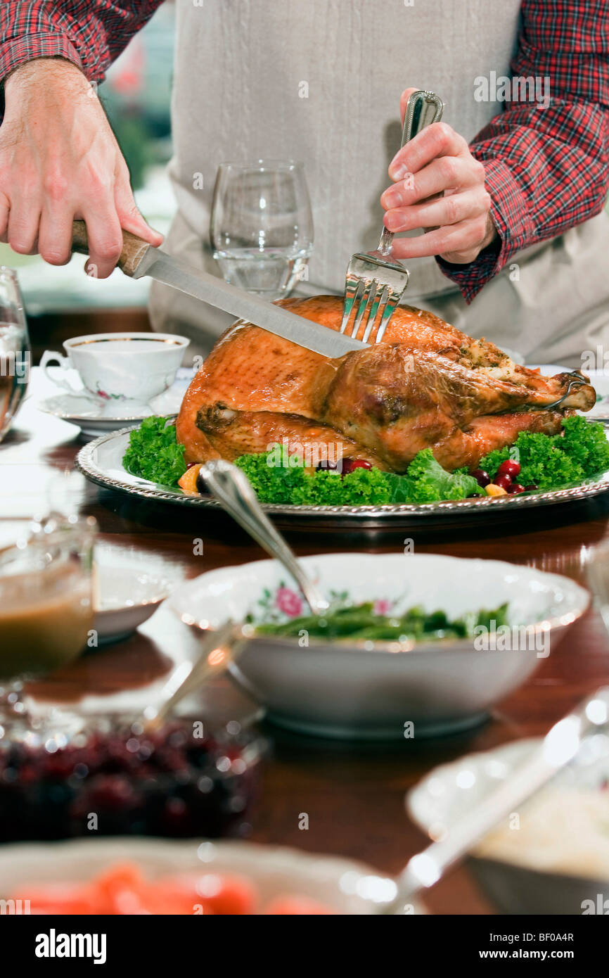 Human hands carving a roast turkey Stock Photo - Alamy