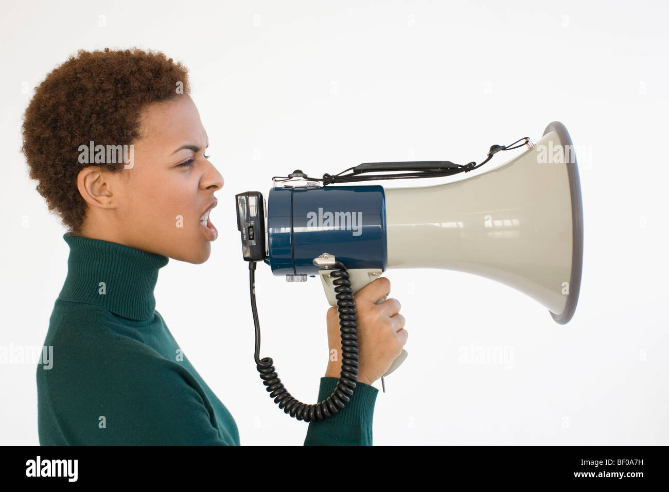 Businesswoman shouting into a megaphone Stock Photo - Alamy