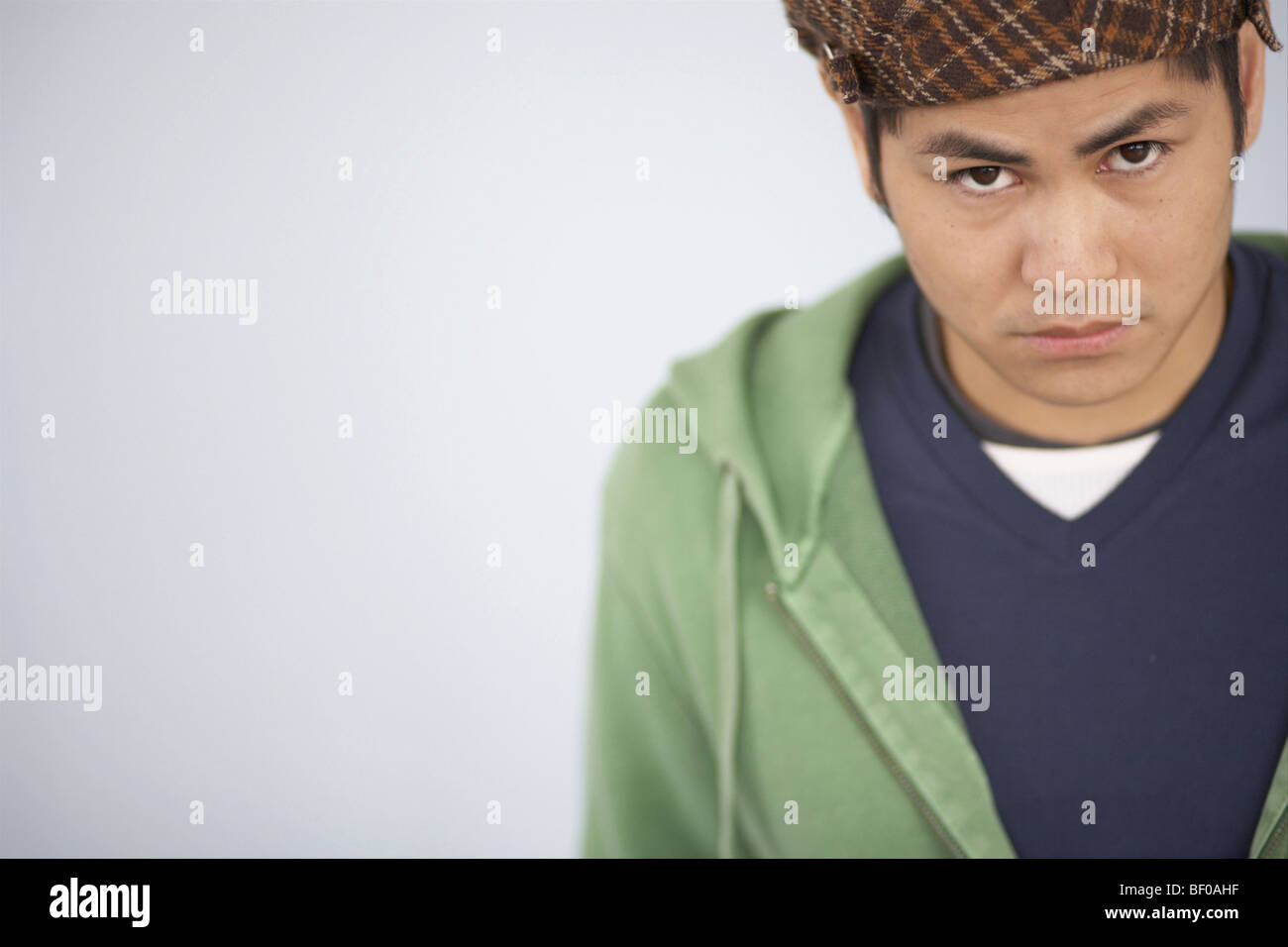 Portrait of a teenage boy looking serious Stock Photo - Alamy