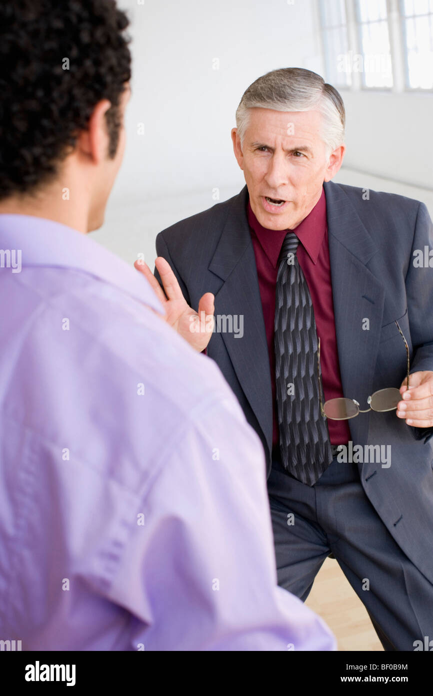 Two businessmen arguing with each other Stock Photo - Alamy