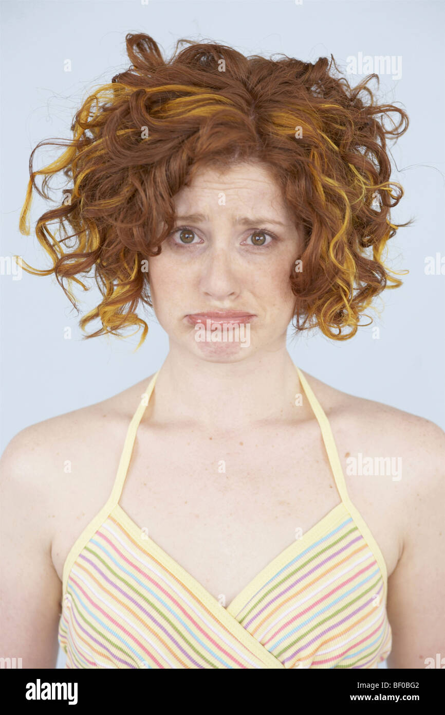 Portrait of a young woman looking sad Stock Photo - Alamy