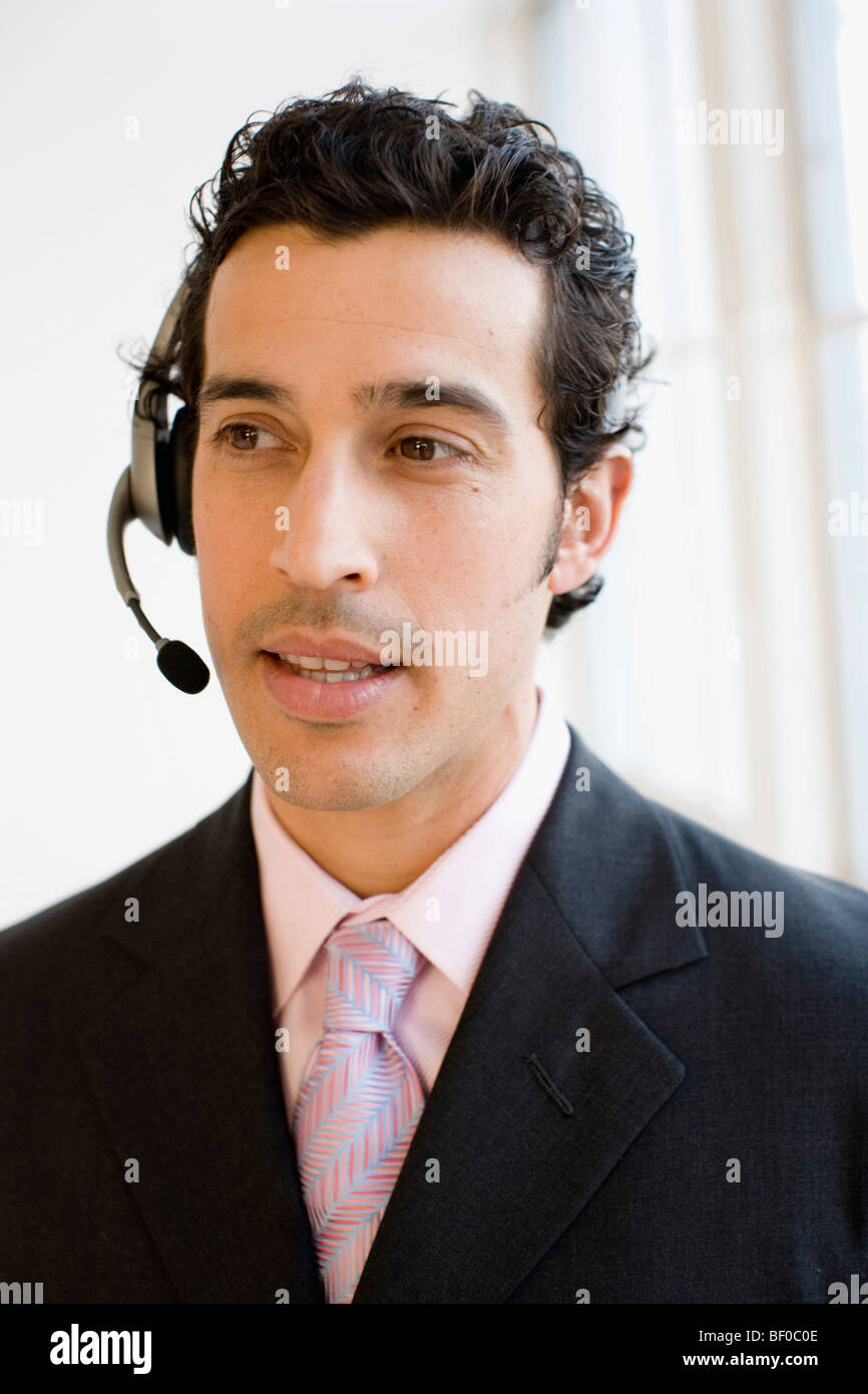 Businessman wearing bluetooth headset hi-res stock photography and ...
