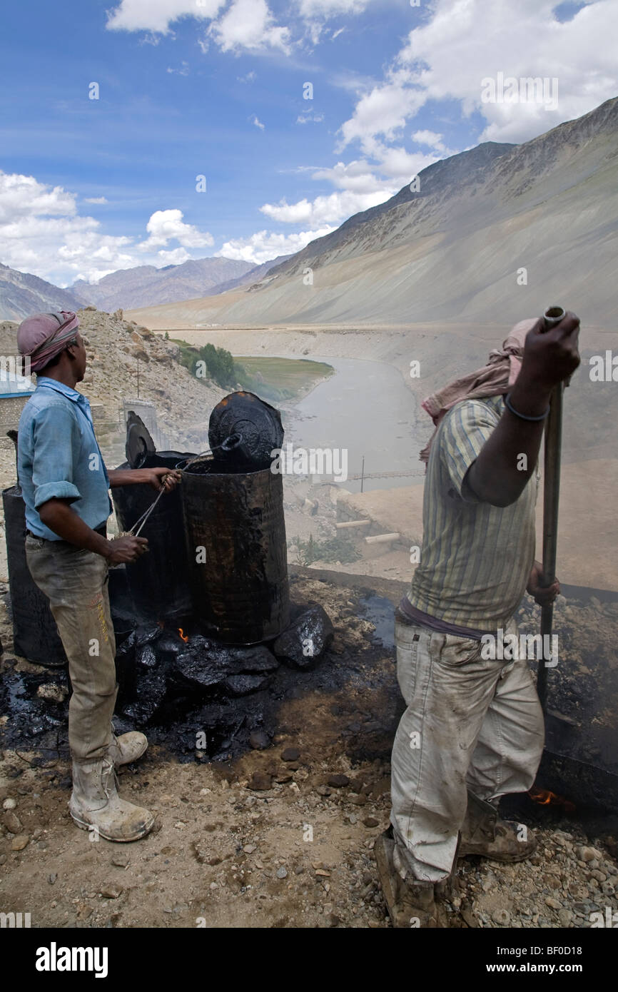 Men making tar. Road near Padum. Zanskar. India Stock Photo - Alamy