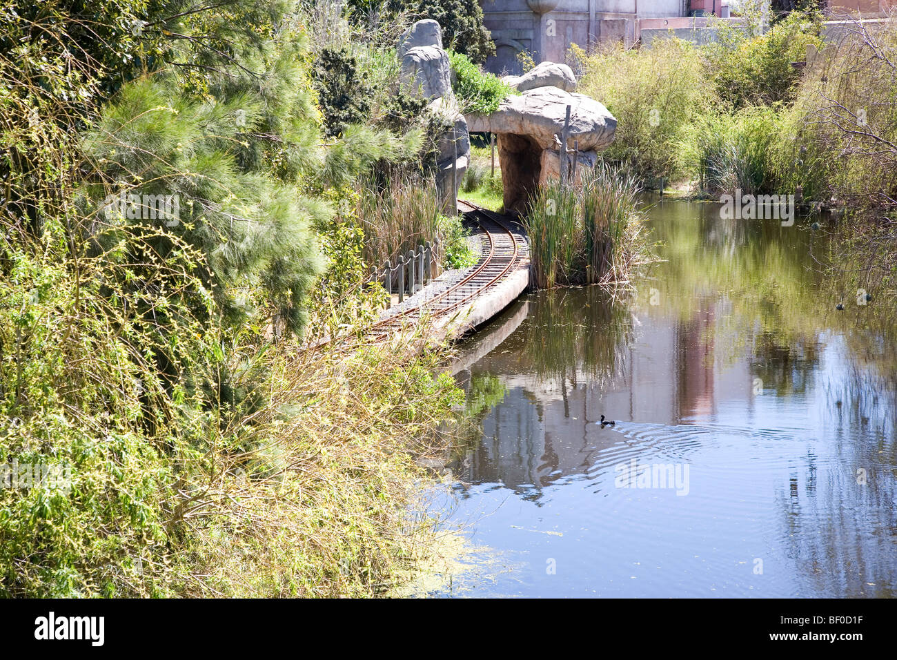 Train Track through man made cave Stock Photo - Alamy