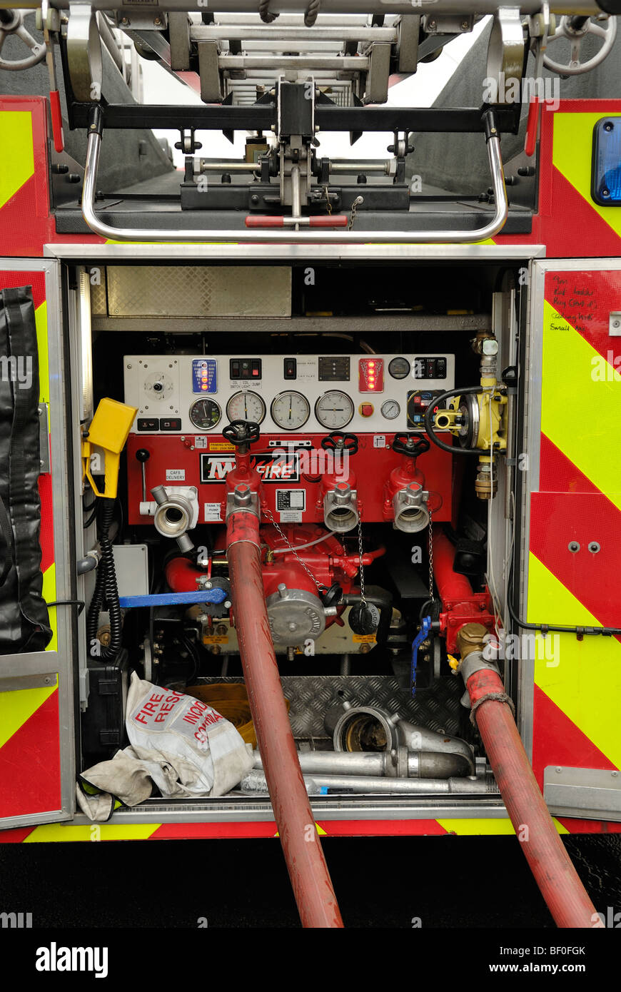 fire engine rear pump locker with hose attached Stock Photo - Alamy