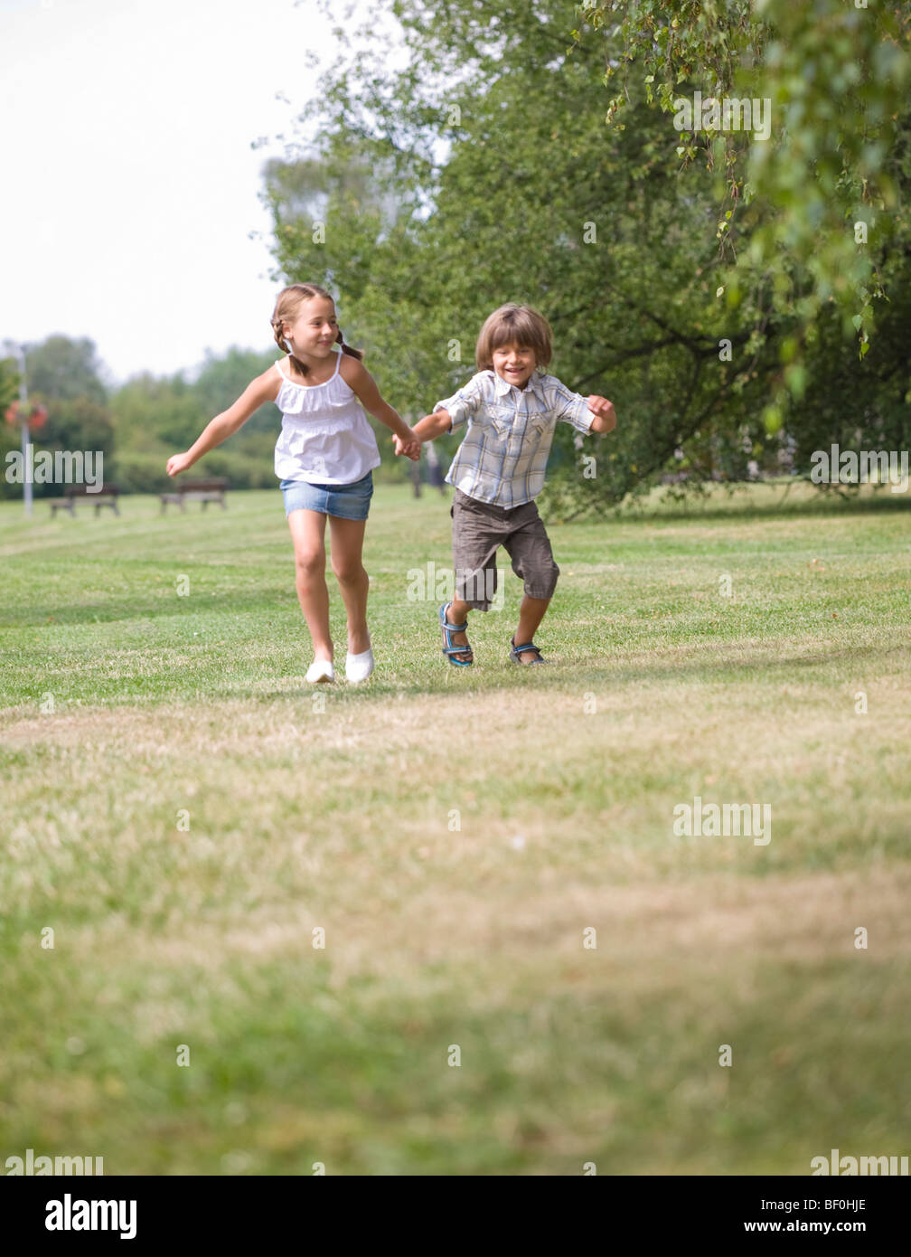Boy girl running in forest hi-res stock photography and images - Alamy