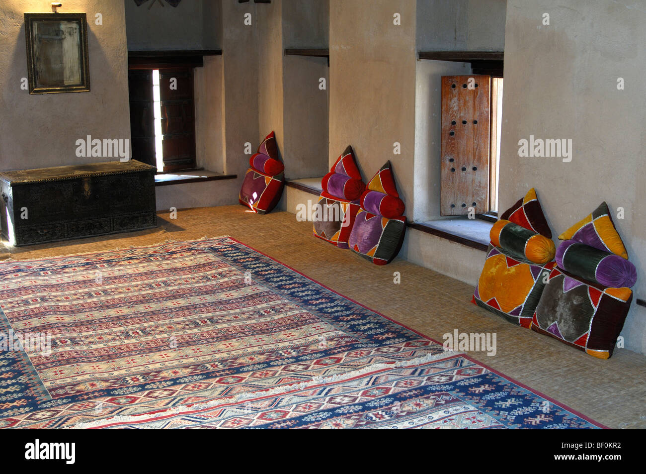 Traditional Arab living room with carpet and pillows, Fort of Nizwa ...