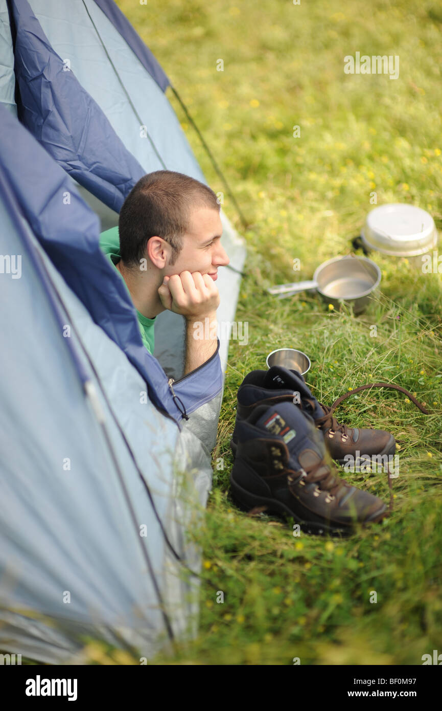 Young Man Camping Stock Photo - Alamy