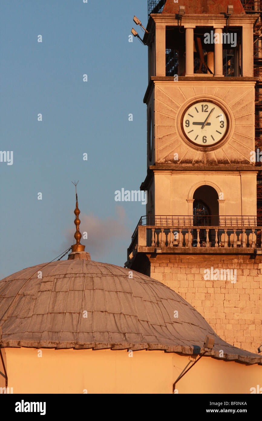 Dome of the Ethem Bey Mosque and the clock tower in Skanderbeg Square ...