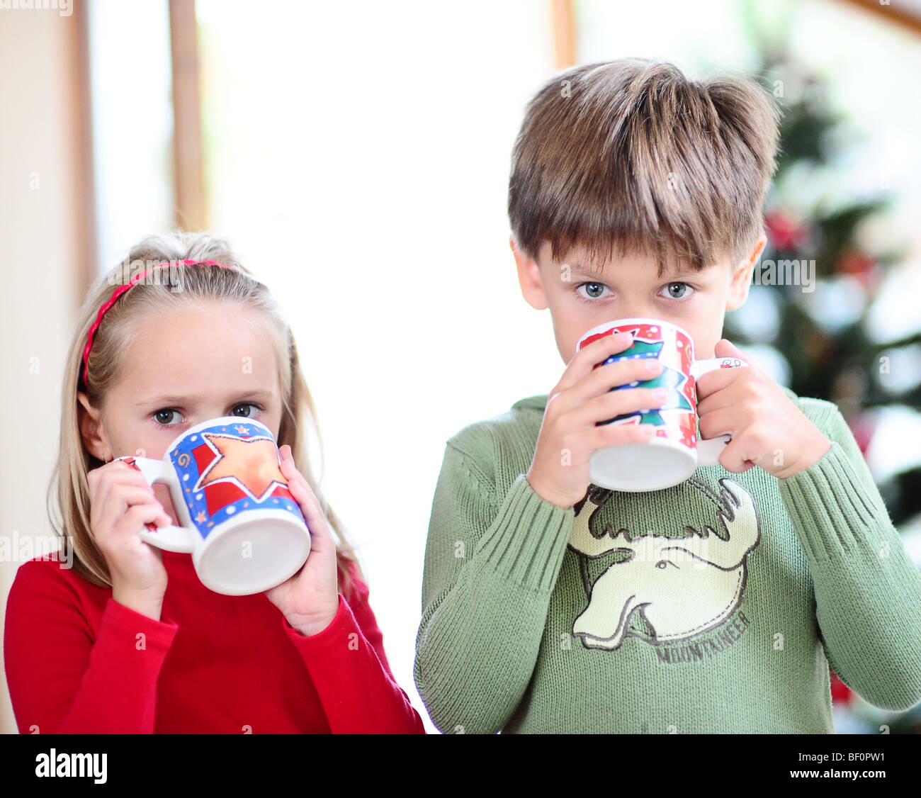 Two Little Children Drinking Stock Photo - Alamy