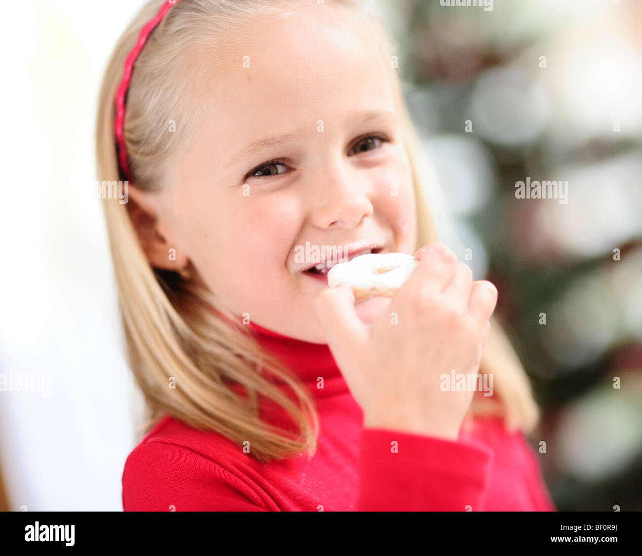 Detail of Small Girl Eating Sweets Stock Photo - Alamy