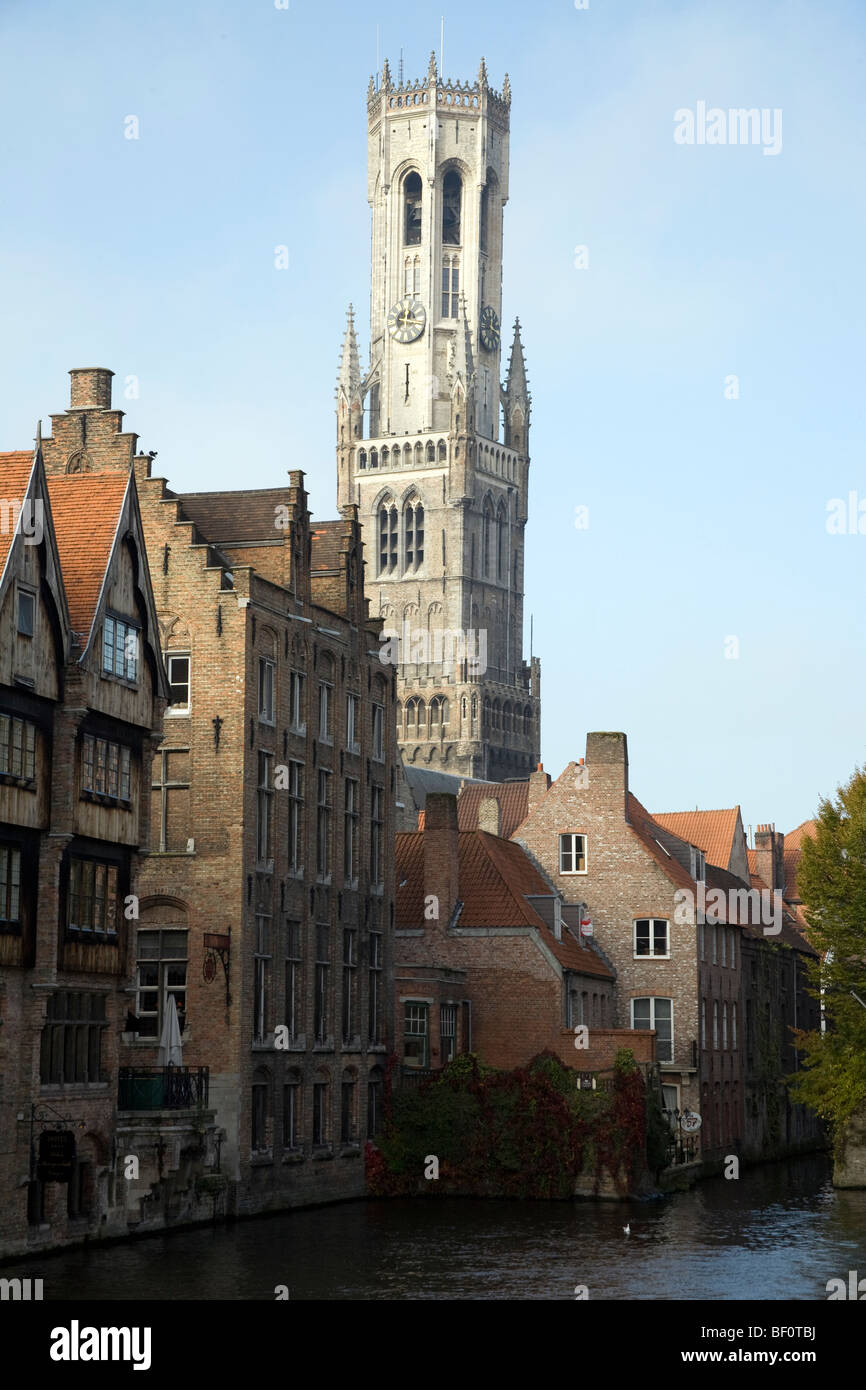 Canal and Gothic style waterside buildings with the Belfry tower or ...