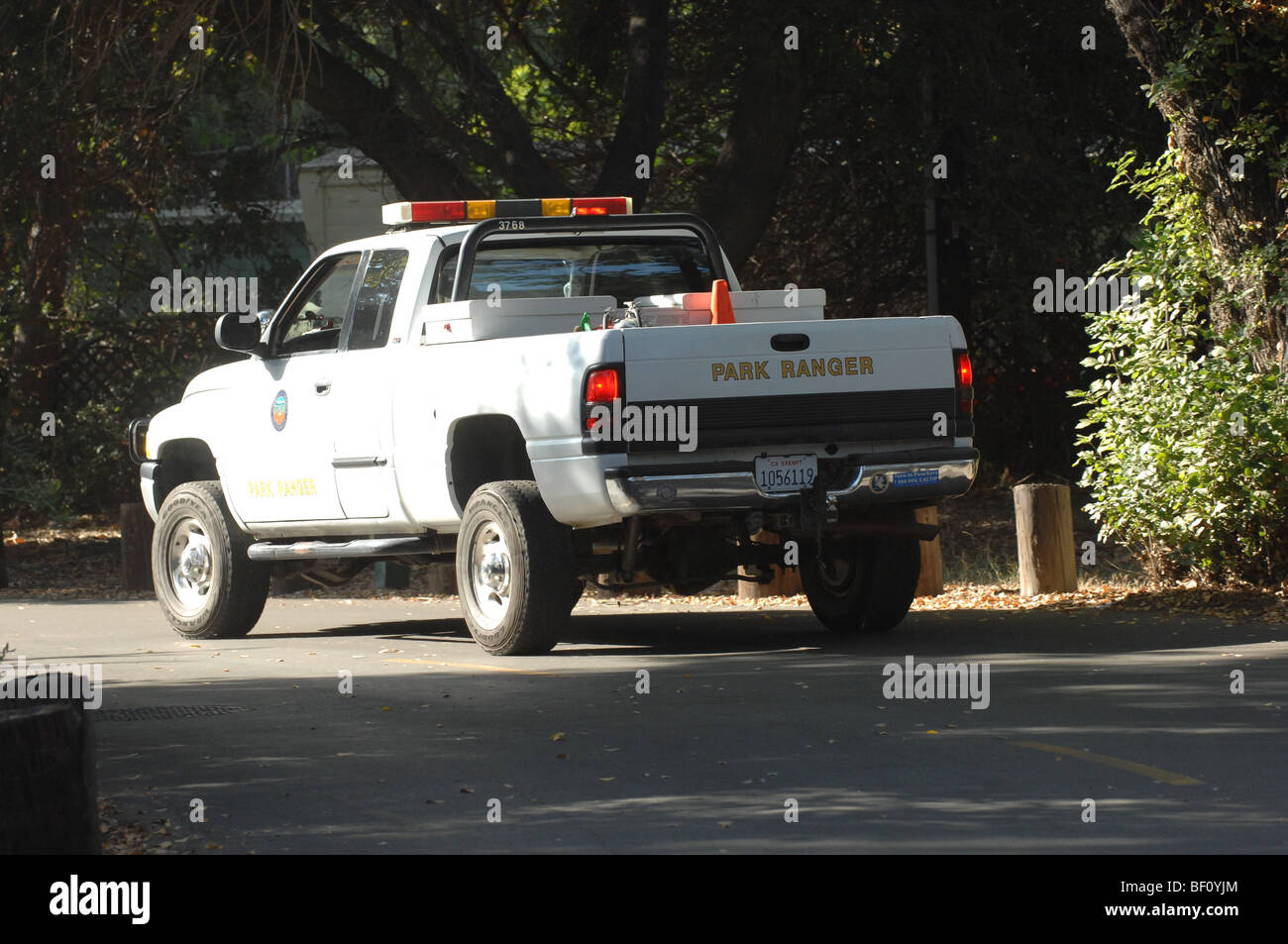 A Park Ranger vehicle patrols Irvine Regional Park in a white truck ...