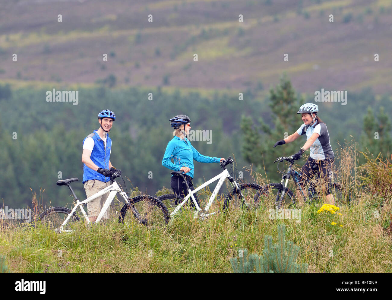 Friends cycling on a purpose built cross country mountain bike course ...