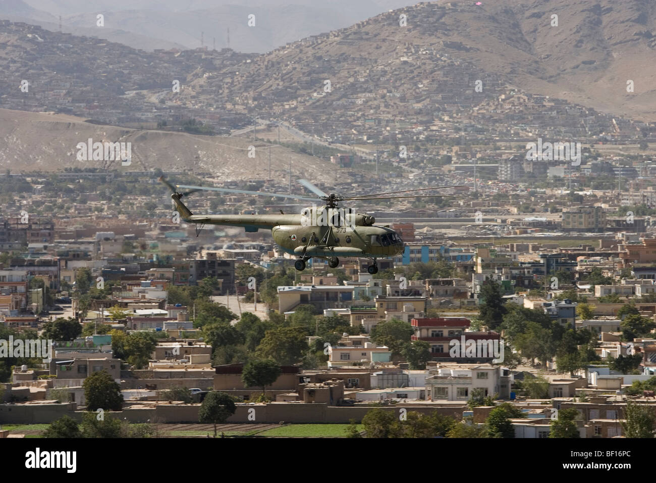 NATO ISAF helicopter flies over the city of Kabul Afghanistan on ...