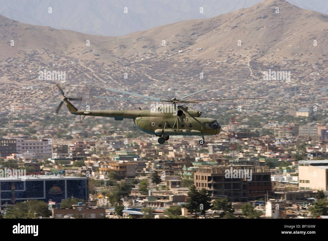 NATO ISAF helicopter flies over the city of Kabul Afghanistan on ...