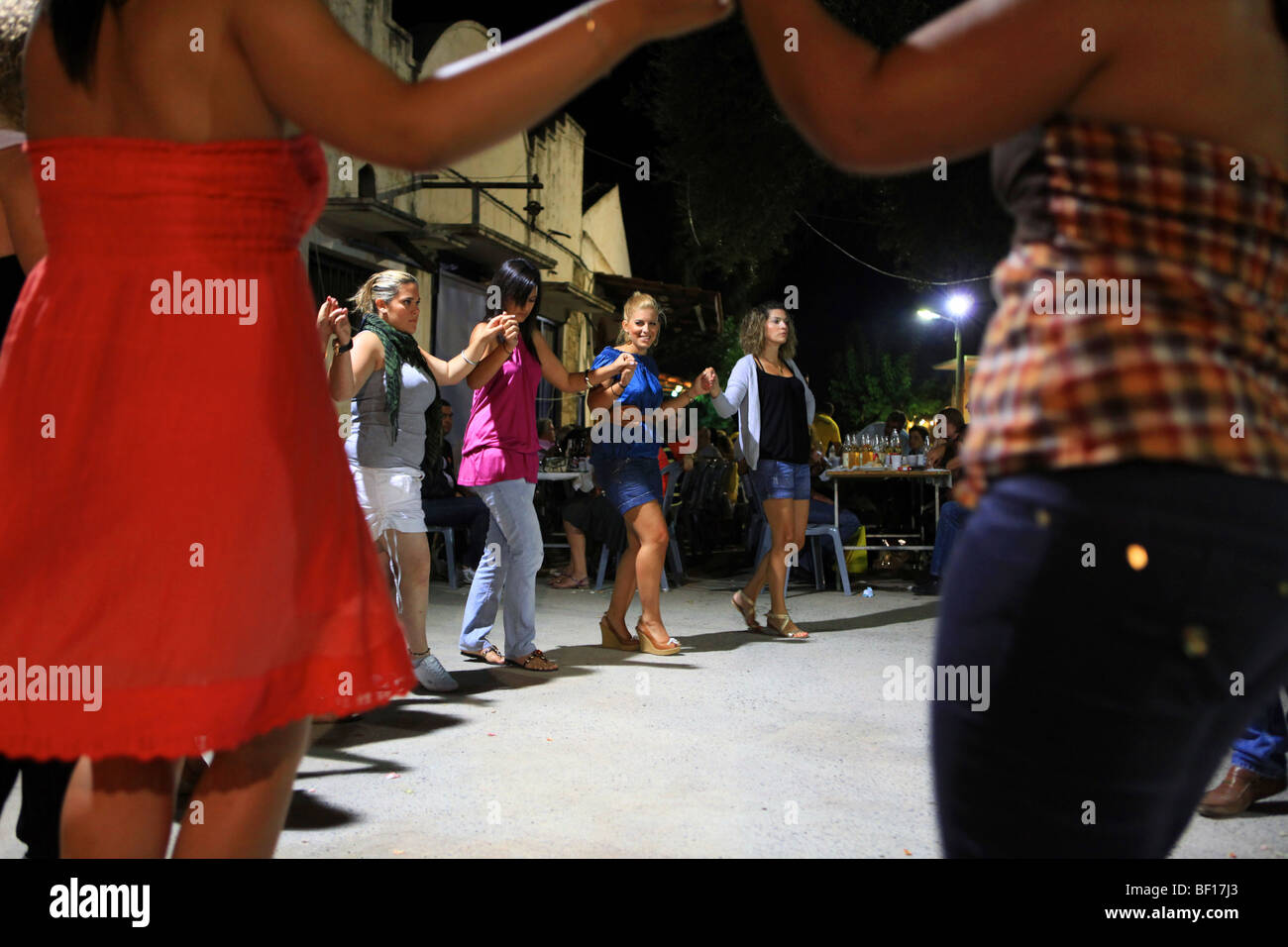 Greek Village women dance in the street in Prines, Crete, at a party ...