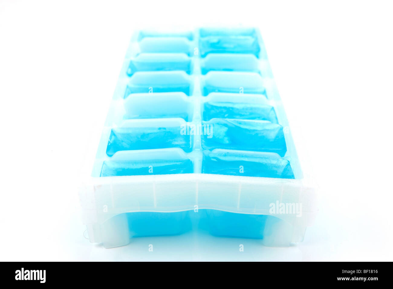 Blue ice blocks isolated against a white background Stock Photo - Alamy