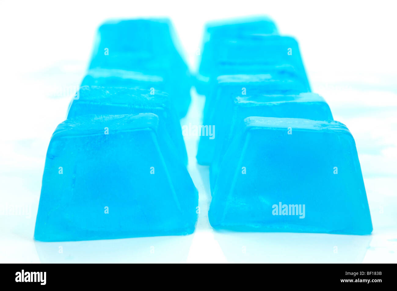 Blue ice blocks isolated against a white background Stock Photo - Alamy