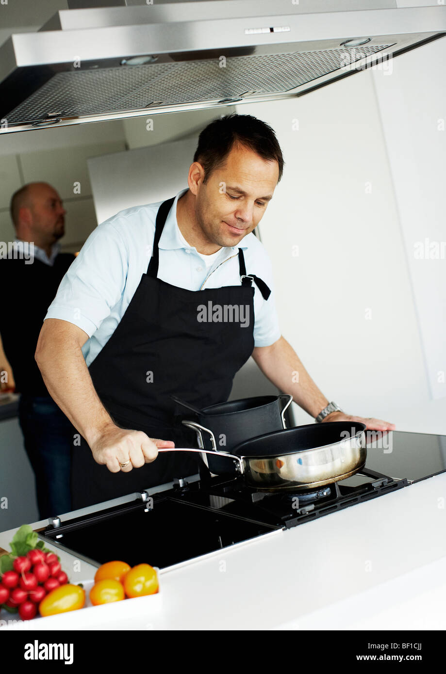 Two men making dinner, Sweden Stock Photo - Alamy