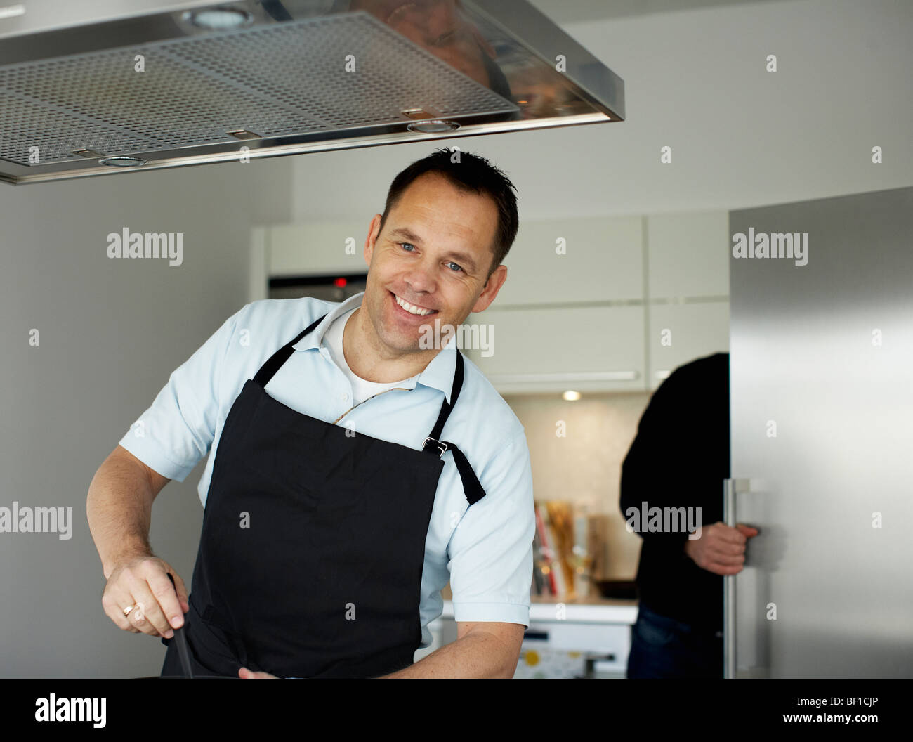 Two men making dinner, Sweden Stock Photo - Alamy