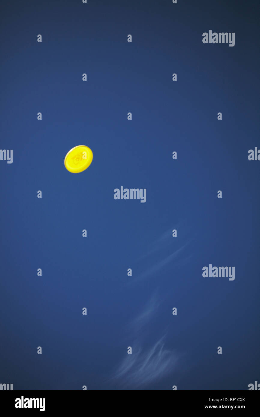 A yellow frisbee against a blue sky, Sweden Stock Photo - Alamy