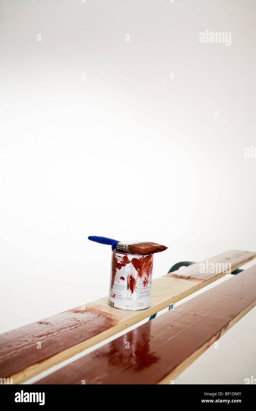 Paintbrush, red paint and a paint bottle Stock Photo - Alamy