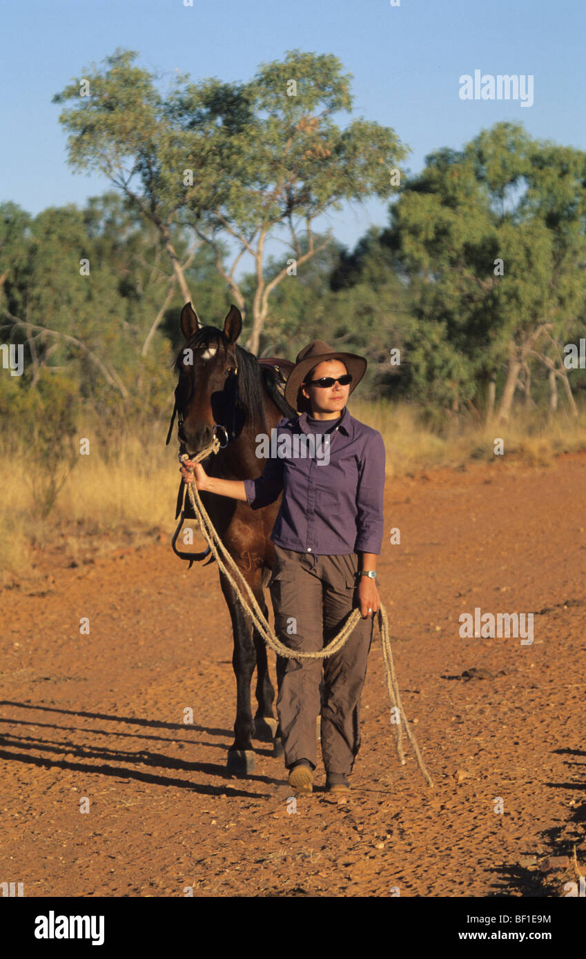 Woman leading horses along hi-res stock photography and images - Alamy