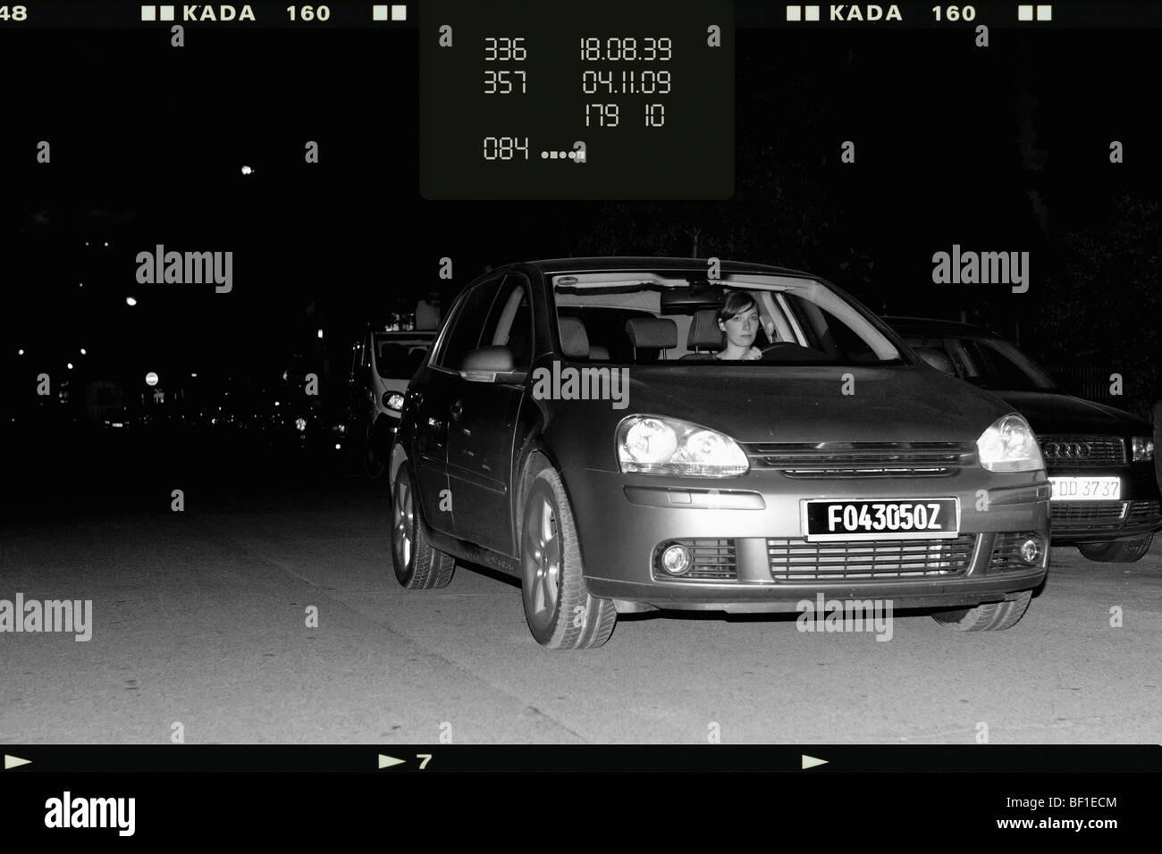 A woman driver getting caught speeding by a speed camera Stock Photo ...