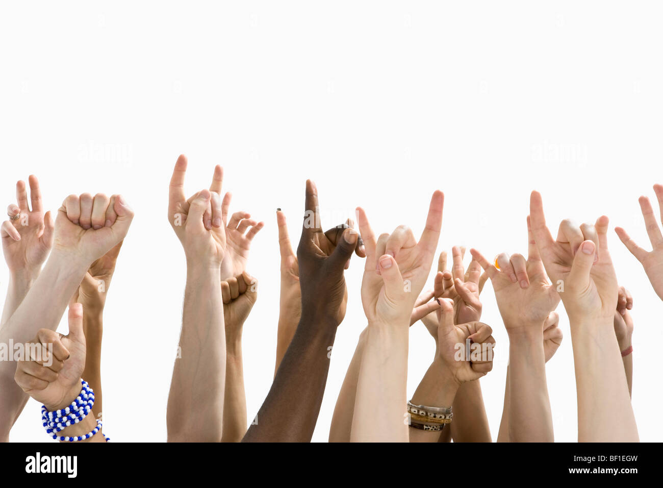 Detail of people with raised hands gesturing Stock Photo - Alamy